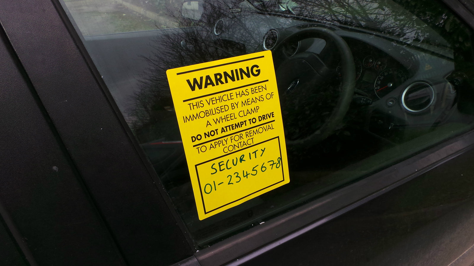 Wheel Clamps Warning Sign